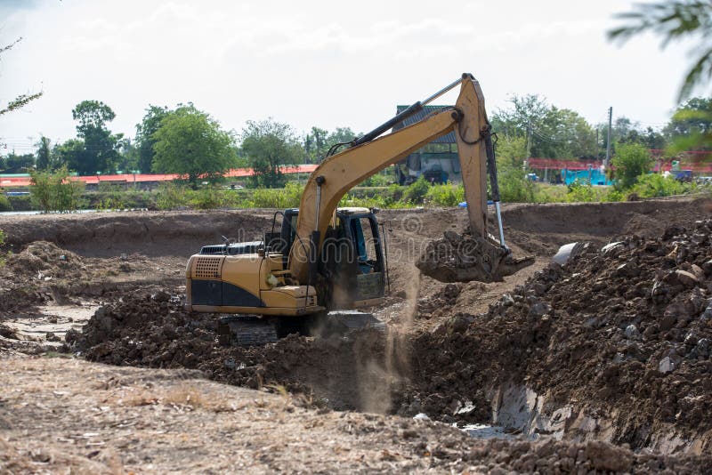Building Machines: Digger Loading Trucks with Soil. Excavator Loading ...