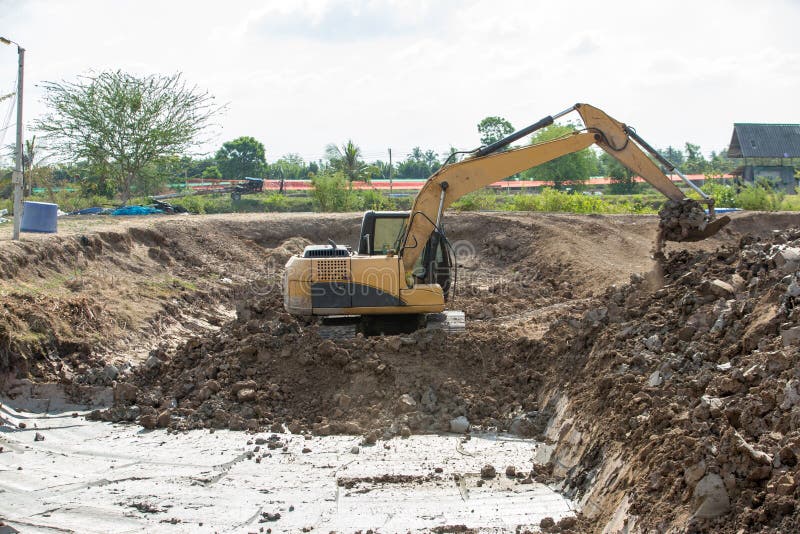 Building Machines: Digger Loading Trucks with Soil. Excavator Loading ...