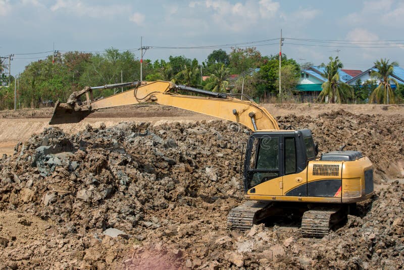 Building Machines: Digger Loading Trucks with Soil. Excavator Loading ...