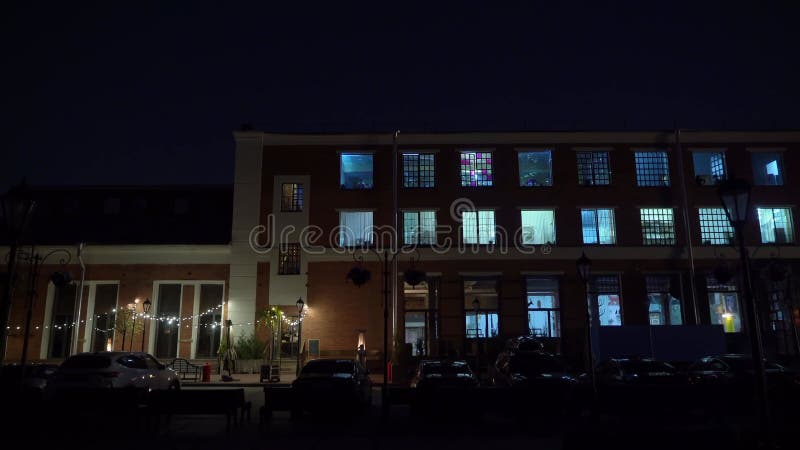 A Building with Many Windows at Night. Illuminated Cityscape Stock ...