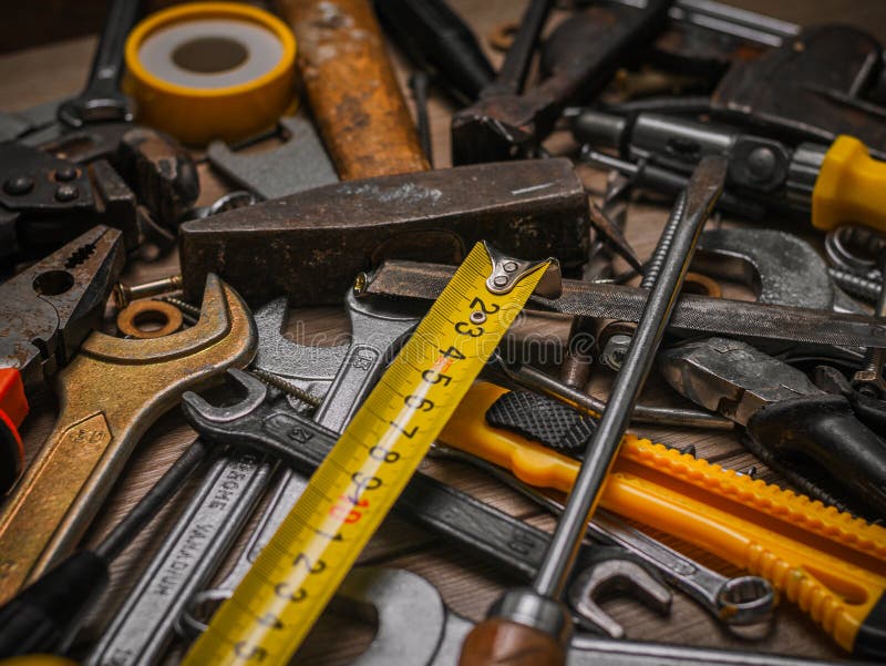 Building and Measuring Tools. Set of Tools Over a Wood Panel Stock ...