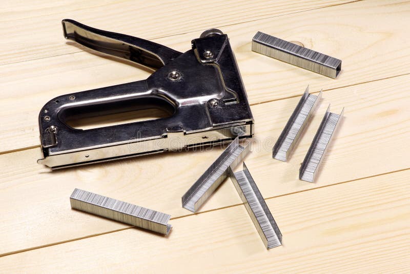 Building Metal Stapler with Staples on a Wooden Table Stock Photo ...