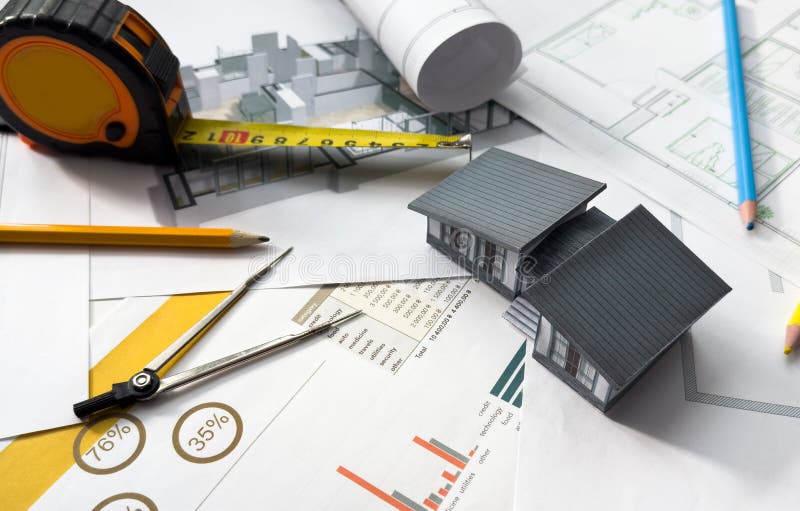 Building Models and Blueprints are Placed on Work Desks in the Construction Engineering Team ...