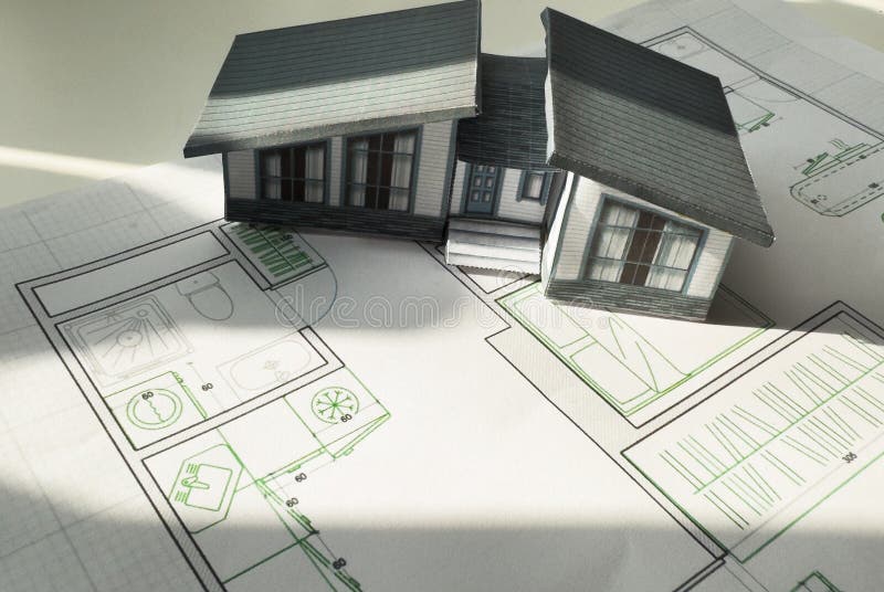 Building Models and Blueprints are Placed on Work Desks in the ...