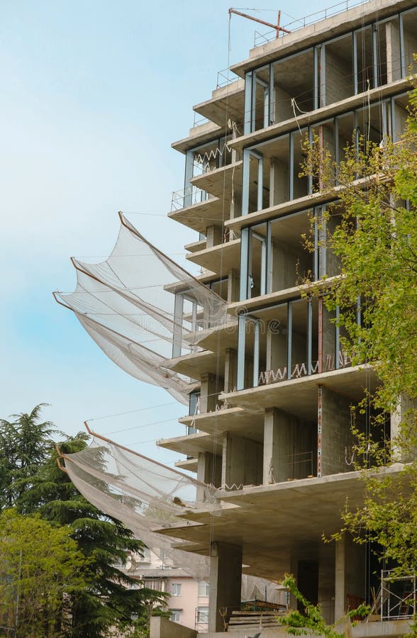 A Building with a Netting on it Stock Photo - Image of estate, white ...