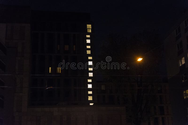 Building at Night with Lighted Windows Stock Photo - Image of ...