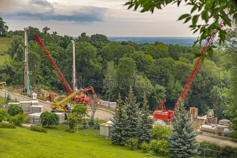 Building Place in the Green Park. Construction Cranes and Devices Build ...