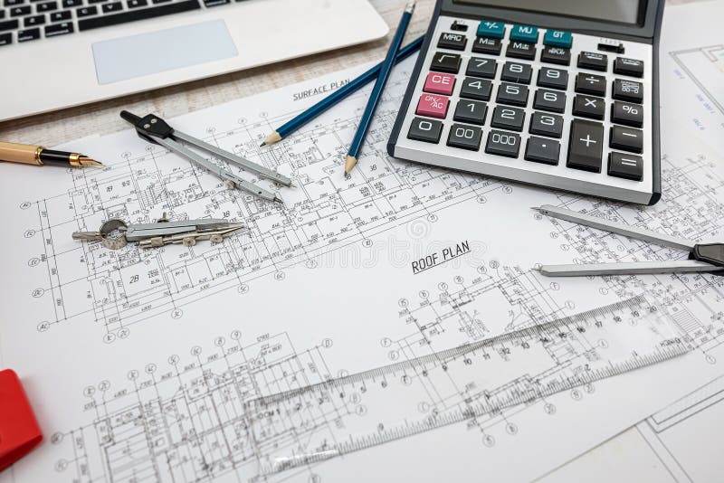 Building Plans Drawing with Helmet and Drawing Tools. Stock Photo ...