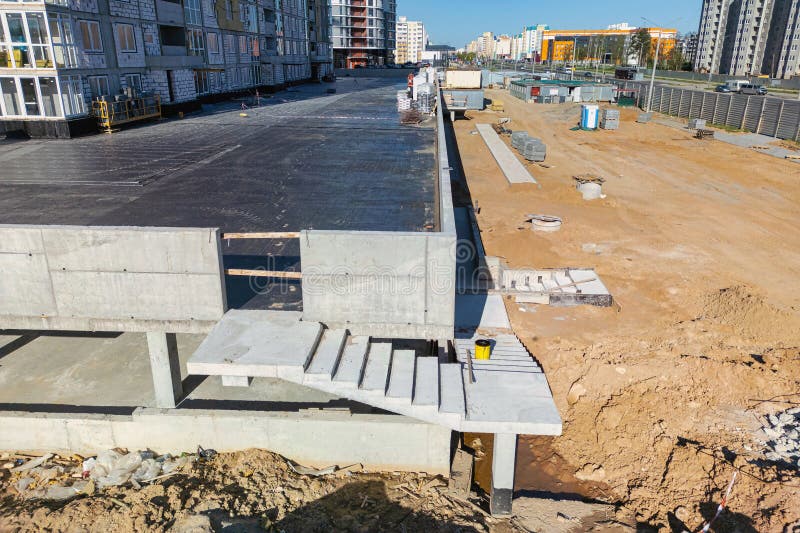 A Building in the Process of Construction Stands Amidst the Urban ...