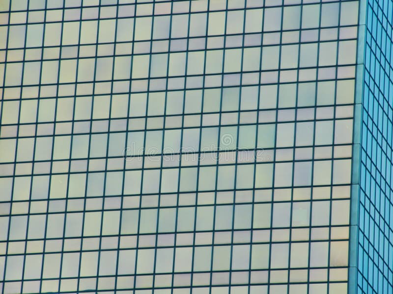 A Building of Rectangular Glass Windows with Reflections Stock Photo ...