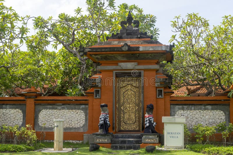 Building with a Red Door and Two Statues on Either Side Stock Photo ...