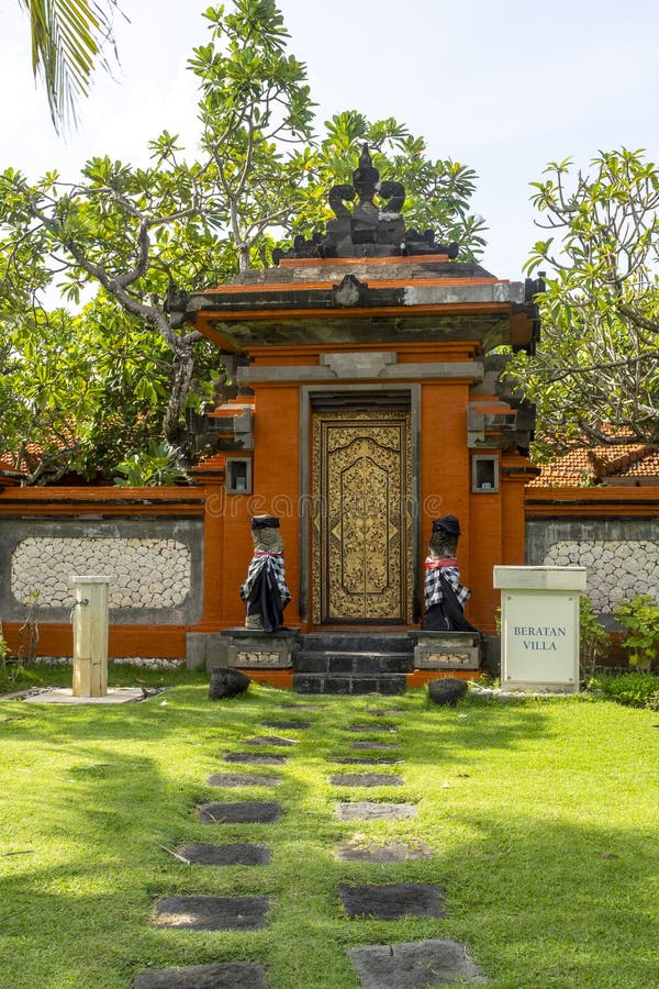 Building with a Red Door and Two Statues on Either Side Stock Image ...