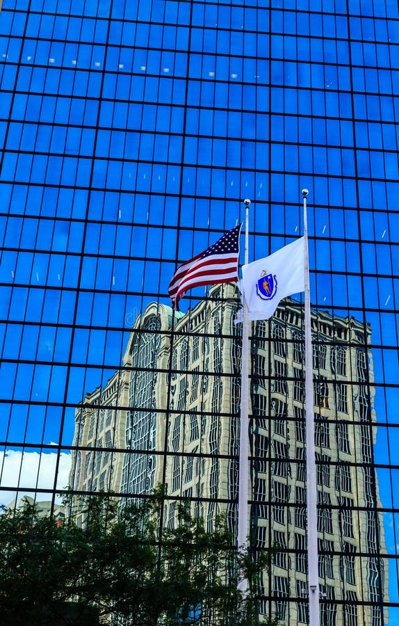 Flags at Blue Glass Office Tower Stock Photo - Image of financial ...