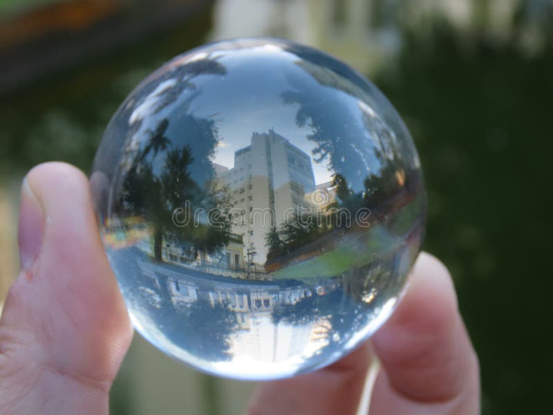 Building Reflected in a Glass Ball, Reflection Inverted in the Water ...