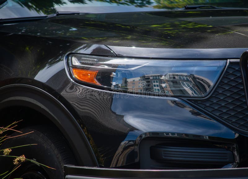 A Building Reflected in the Lens of the Headlight Stock Photo - Image ...