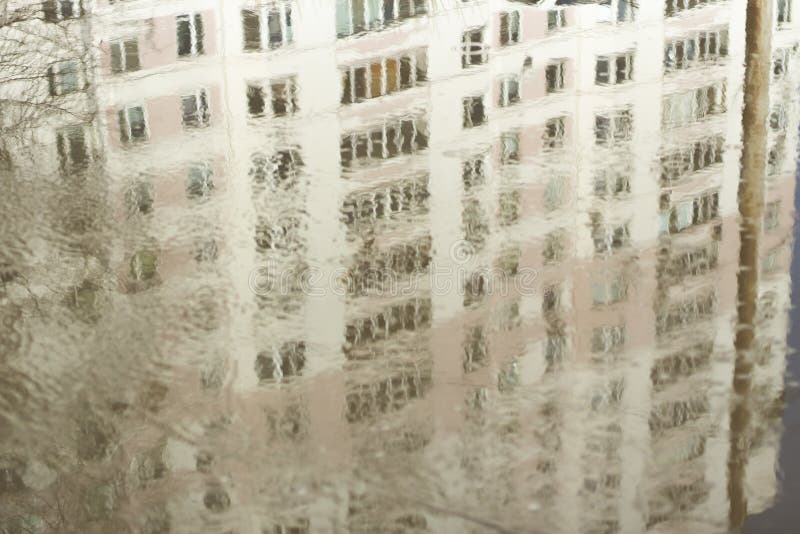Building is Reflected in Puddle. Surface of Water in City Stock Image ...