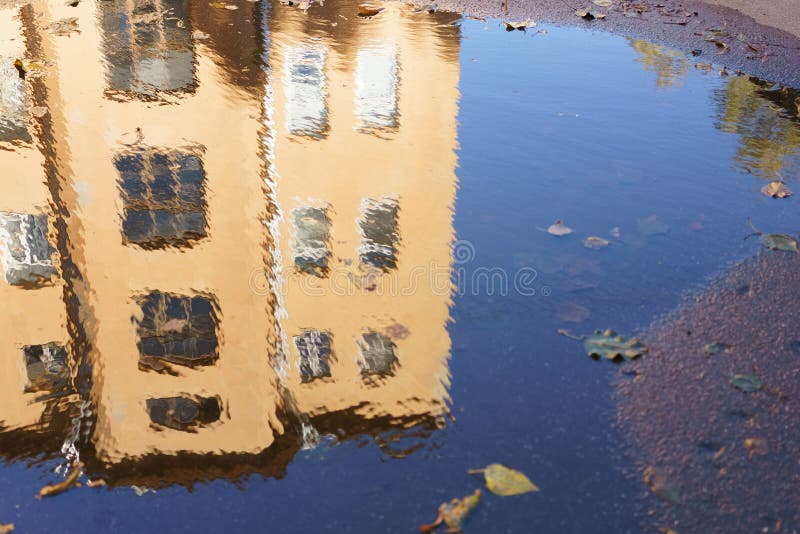Building is Reflected in a Puddle of Water Stock Image - Image of ...