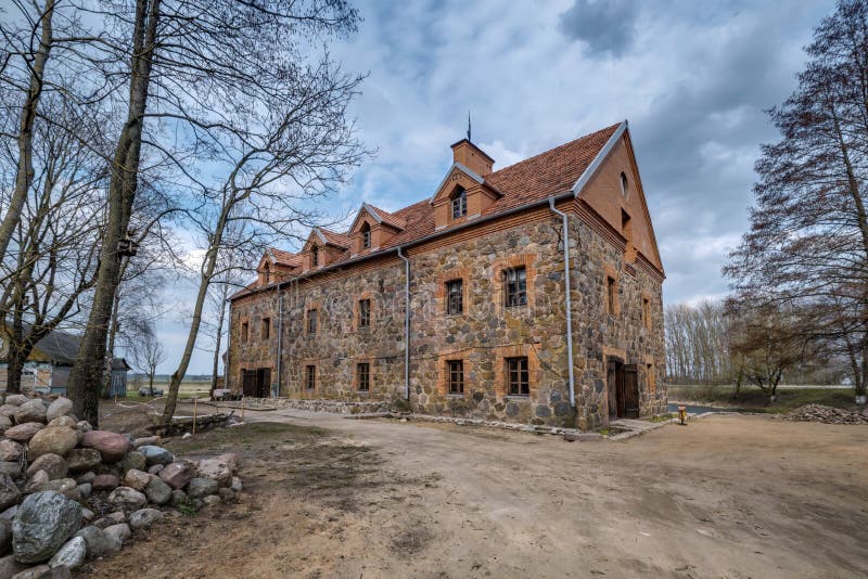 The Building of the Restored Old Stone Mill in Early Spring Stock Photo ...