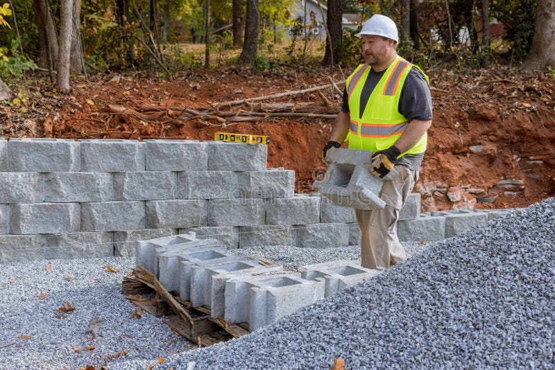 Building a Retaining Wall with Retaining Blocks on the New Property is ...