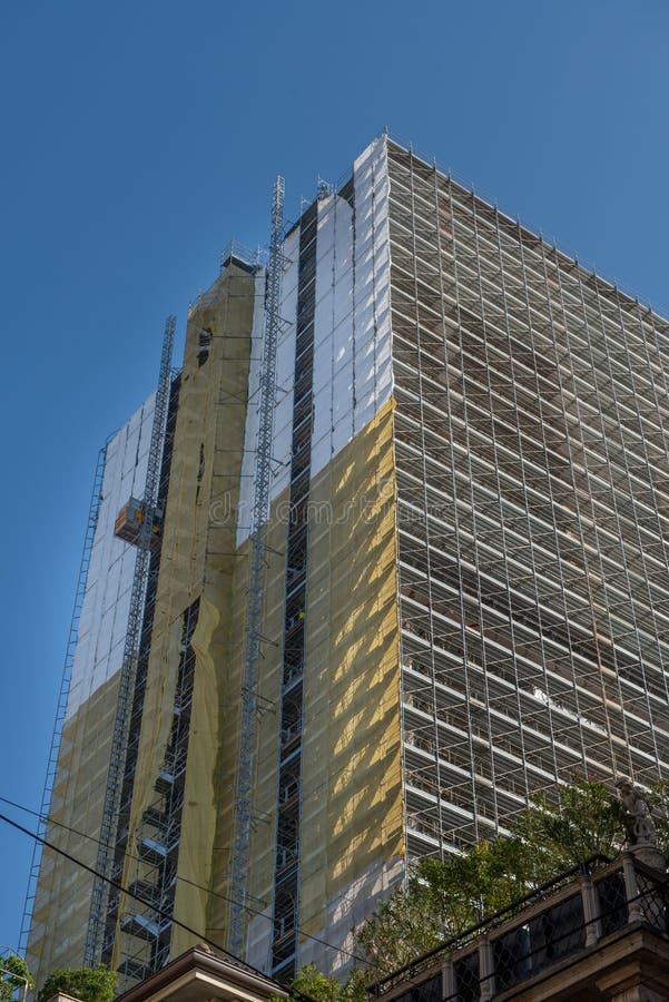Building with Scaffolding and Protective Sheets Stock Photo - Image of ...