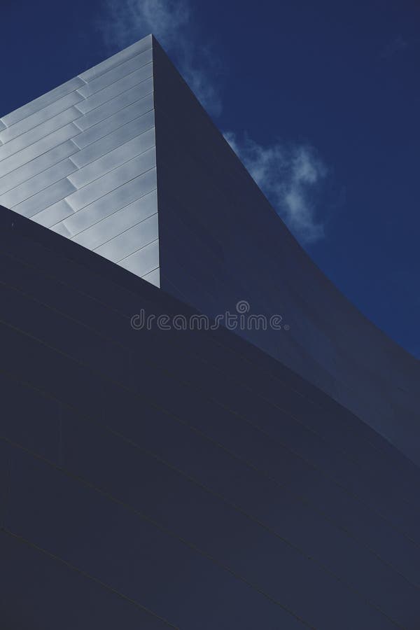 Building with Sharp Angles Light and Dark Contrast Blue Sky Stock Image ...