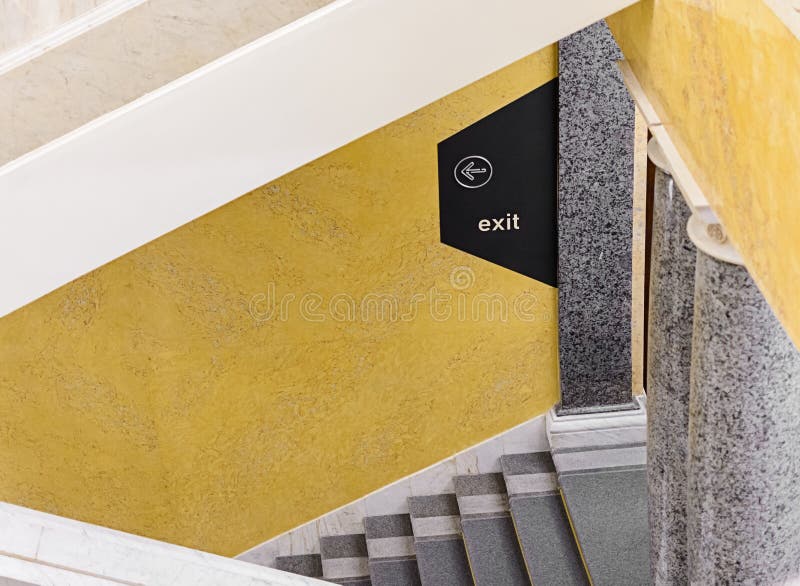 Building Signage Exit on the Marble Yellow Wall Stock Image - Image of ...