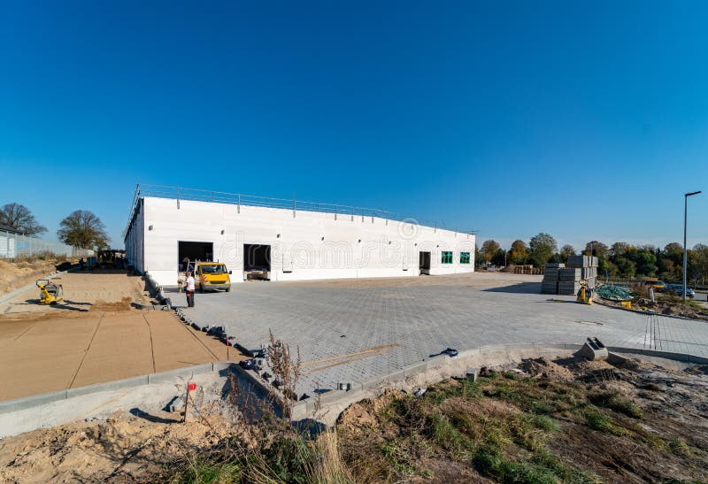 A Building Site the Outdoor Area of a Large Factory Building is Paved ...