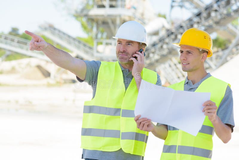 Building Site Supervisor Pointing at Distance Stock Image - Image of ...