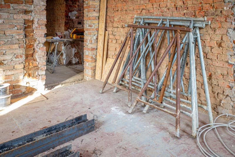 A Building Site, 2 Scaffolding Trestles Lean Against a Brick Wall Stock ...