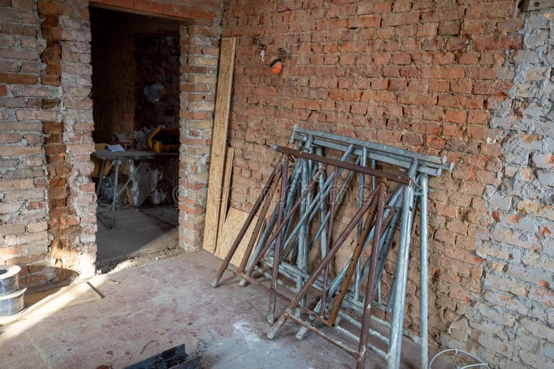 A Building Site, 2 Scaffolding Trestles Lean Against a Brick Wall Stock ...