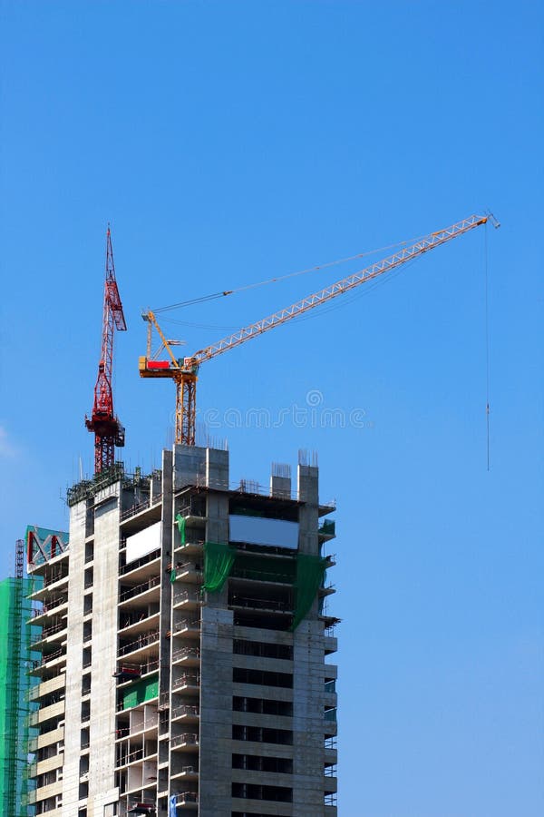 Building of a Skyscraper with Two Tower Cranes Stock Photo - Image of ...