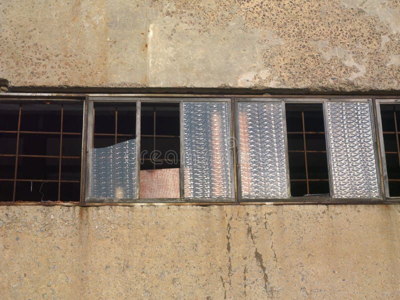 Building with Smashed Windows Stock Image - Image of bars, abandoned ...