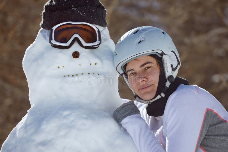 Building a Snowman in a Ski Trip Stock Photo - Image of female, active ...