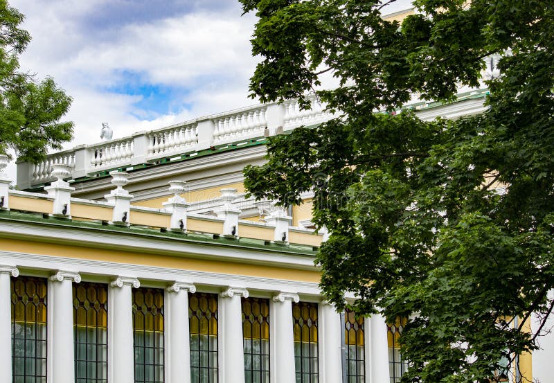 A Building with Stained Glass Windows and Tree Branches Stock Photo ...