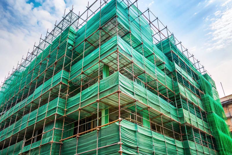 Building Structure with Green Netting Shade and Scaffolding Covered ...