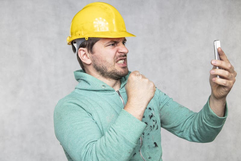 The Building Supervisor is Shouting To a Cell Phone, Side View Stock ...