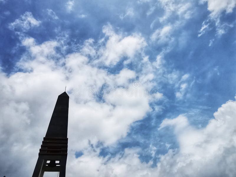 The Structure of a Tall Building Towers into the Blue Sky Covered with ...