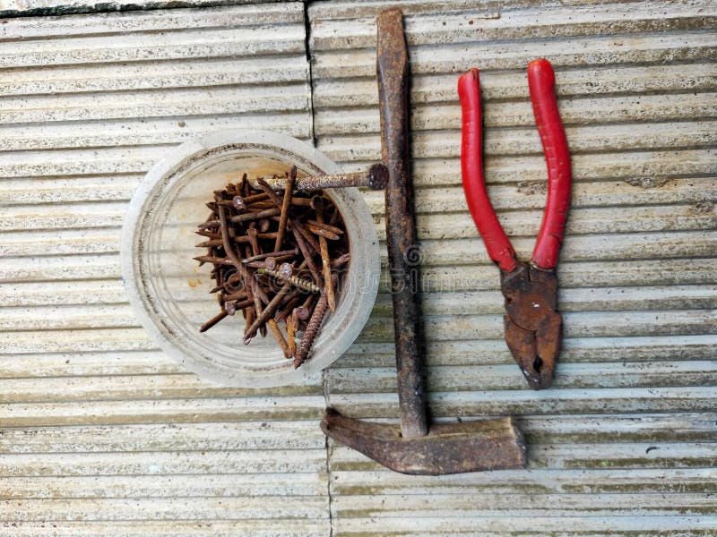 A Building Tool in the Form of Nails, Hammer, and Pliers Stock Photo ...