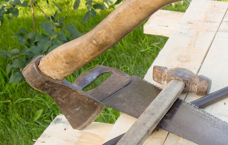 Building Tools Hammer, Axe, Hacksaw Frame, Lie on the Light Boards in ...