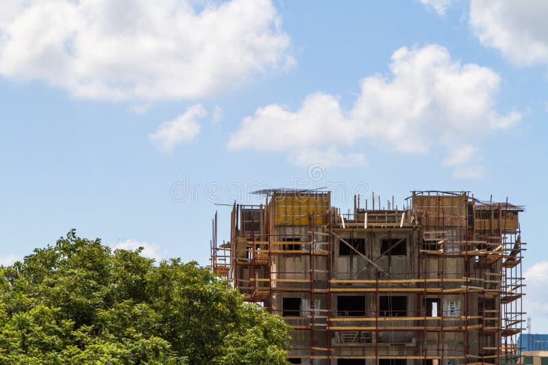 Building Under Construction, Blue Sky with Clouds Stock Image - Image ...