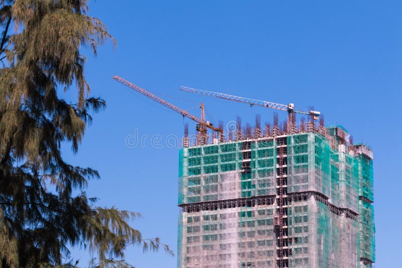 Building Under Construction, Blue Sky and Tree Stock Photo - Image of ...