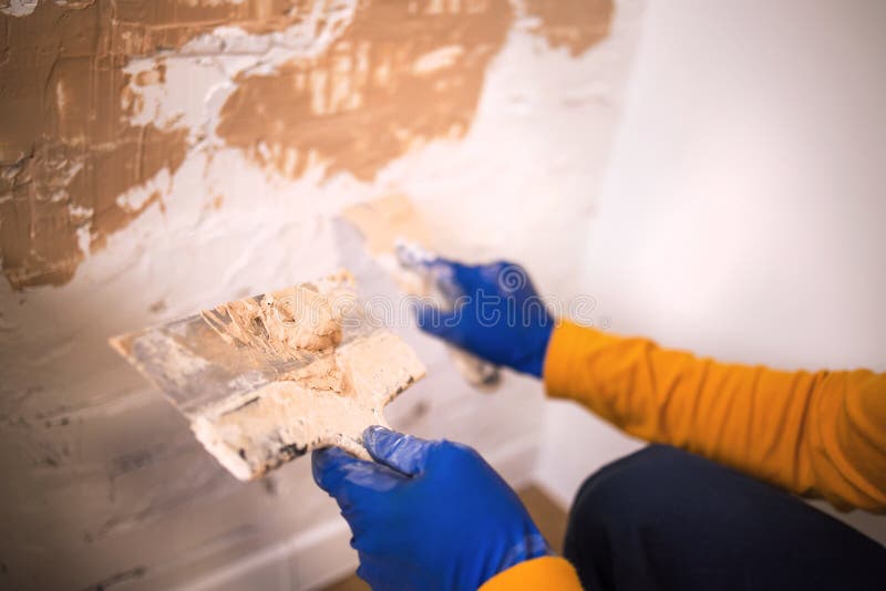 Building Under Construction with Bricklayer Plastering Concrete To ...