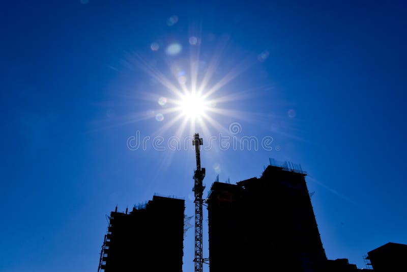 Building Under Construction and a Construction Crane Against the Sky ...