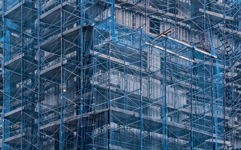 Building Under Construction Covered in Blue Mesh Tarp Protective Wrap ...