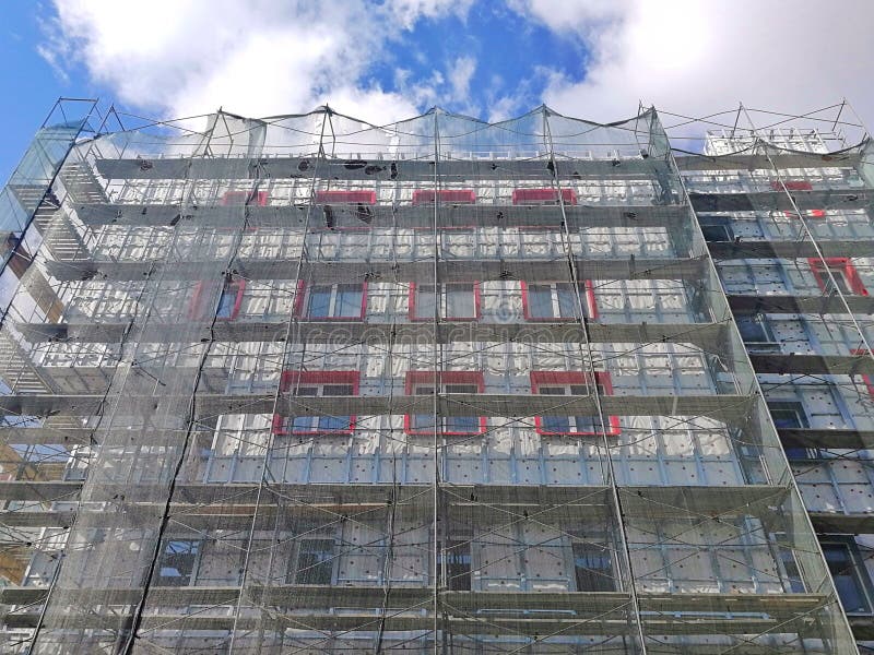 Building Under Construction is Covered with Net for Security Against ...