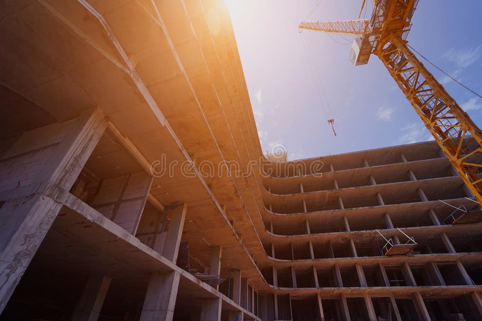 Building Under Construction with a Crane in the Foreground Stock Image ...