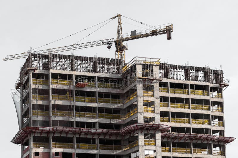 Building Under Construction with a Crane on Top. Stock Photo - Image of ...