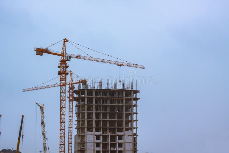Building Under Construction Cranes and Blue Sky Stock Image - Image of ...