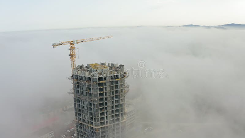 A Building Under Construction Made of Monolithic Concrete Shrouded in ...
