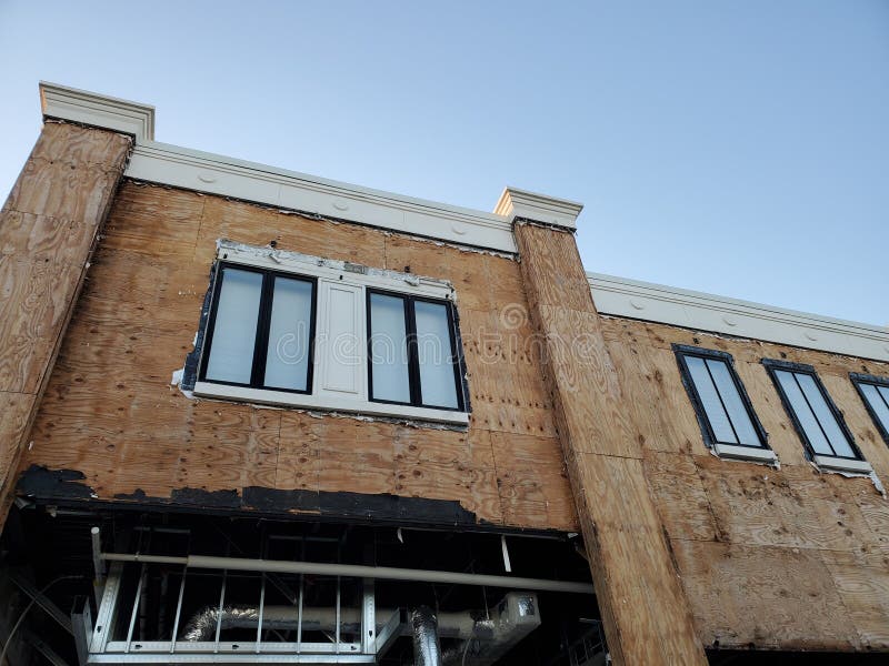Building Under Construction with Raw Wood and Windows Stock Photo ...